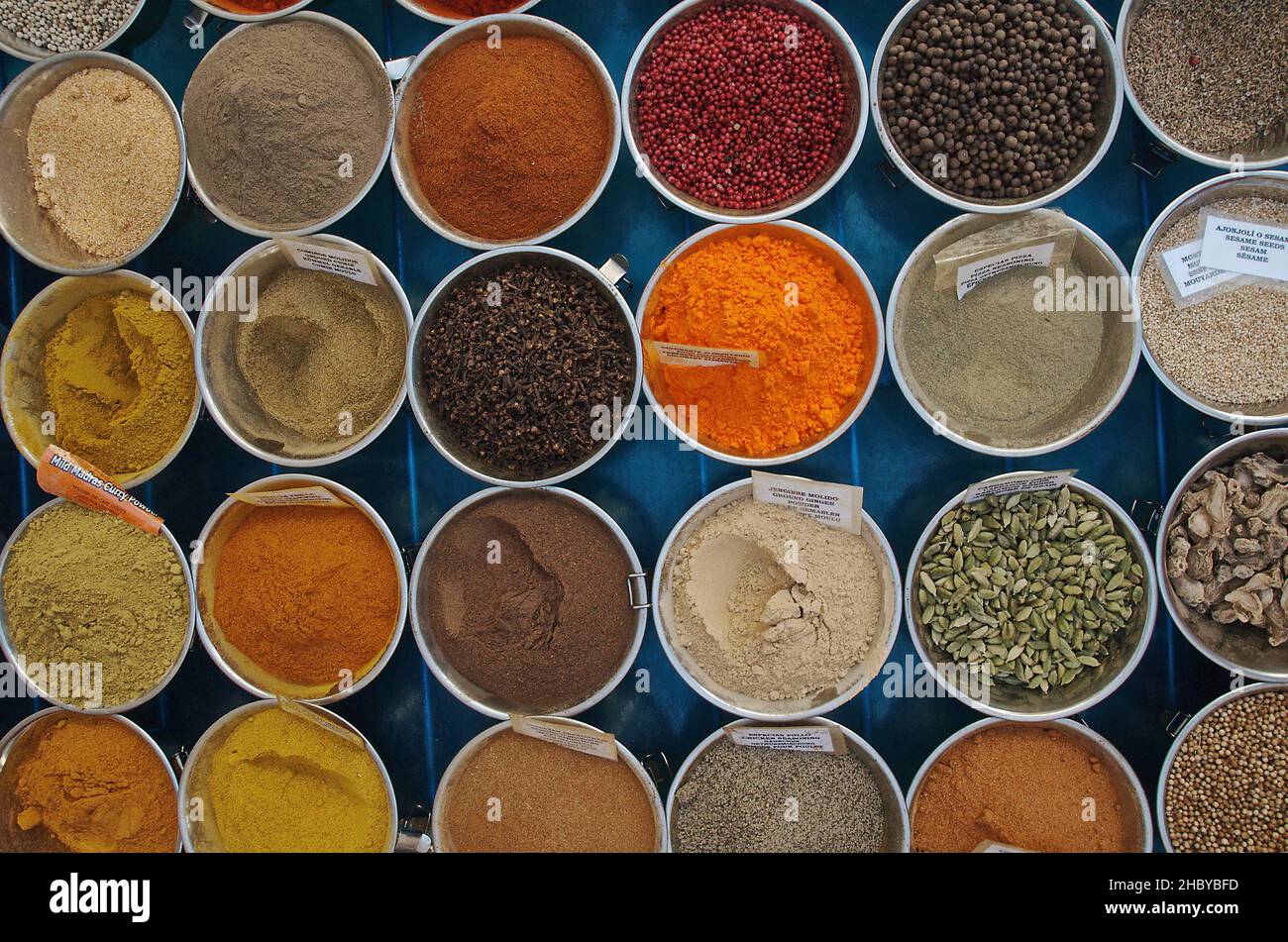 Spice mixture in round containers as powder and as fruit, top view ...