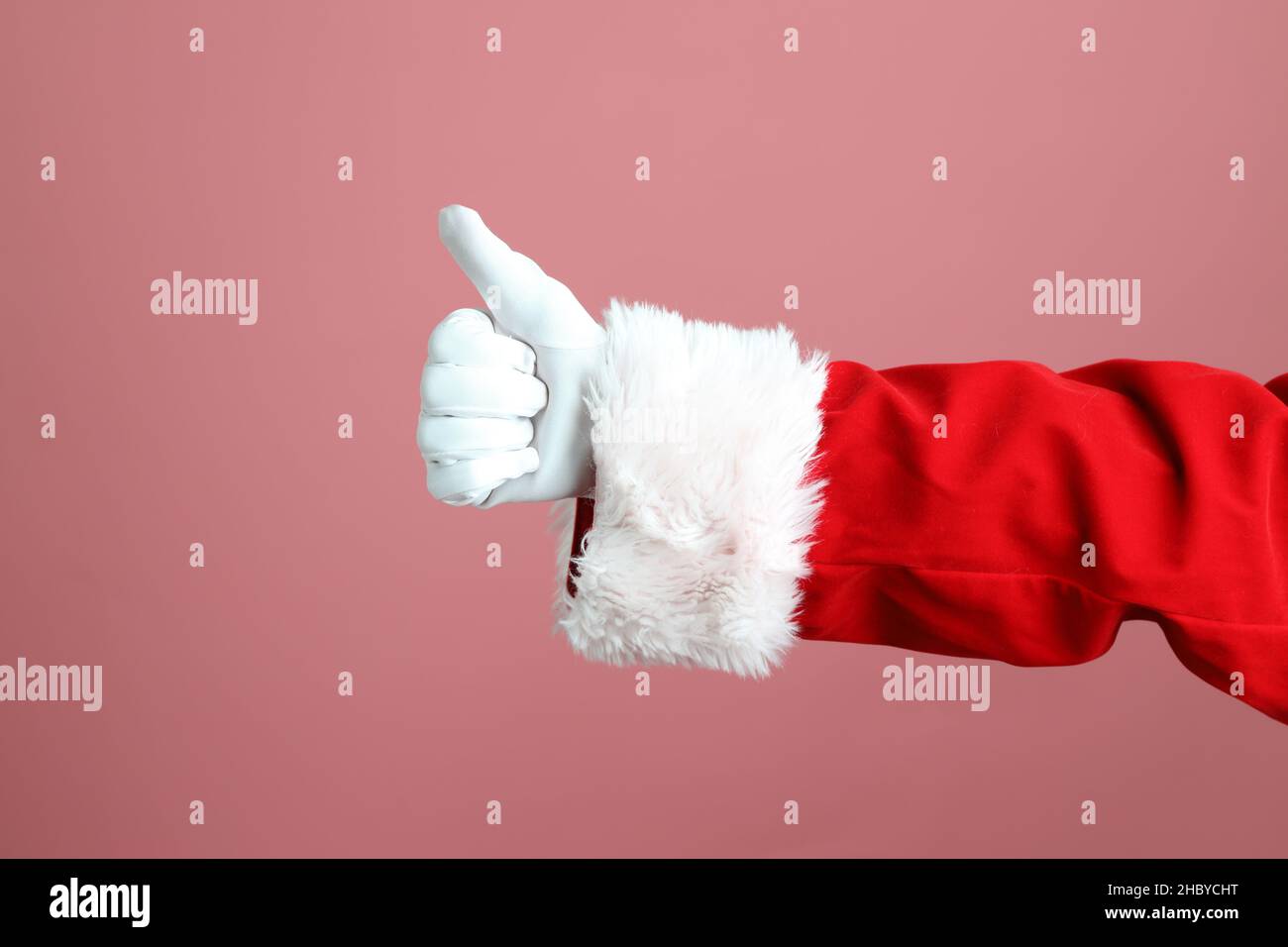 Santa Claus showing hand on the pink background Stock Photo - Alamy