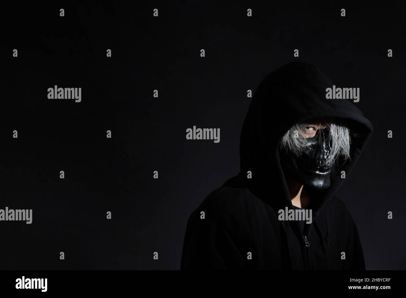 The horror man with skull mask standing in the dark Stock Photo - Alamy
