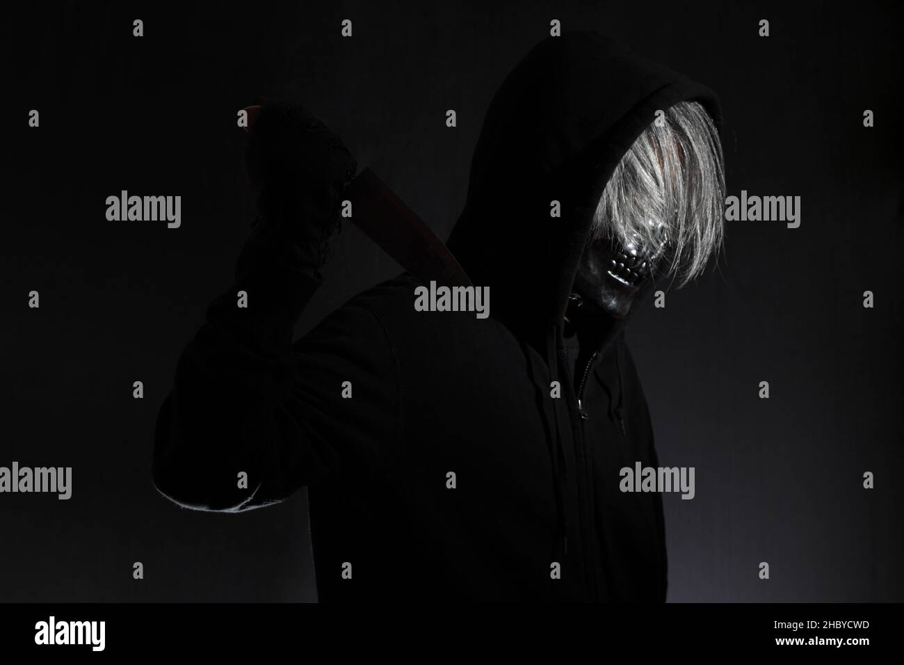 The horror man with skull mask standing in the dark Stock Photo - Alamy