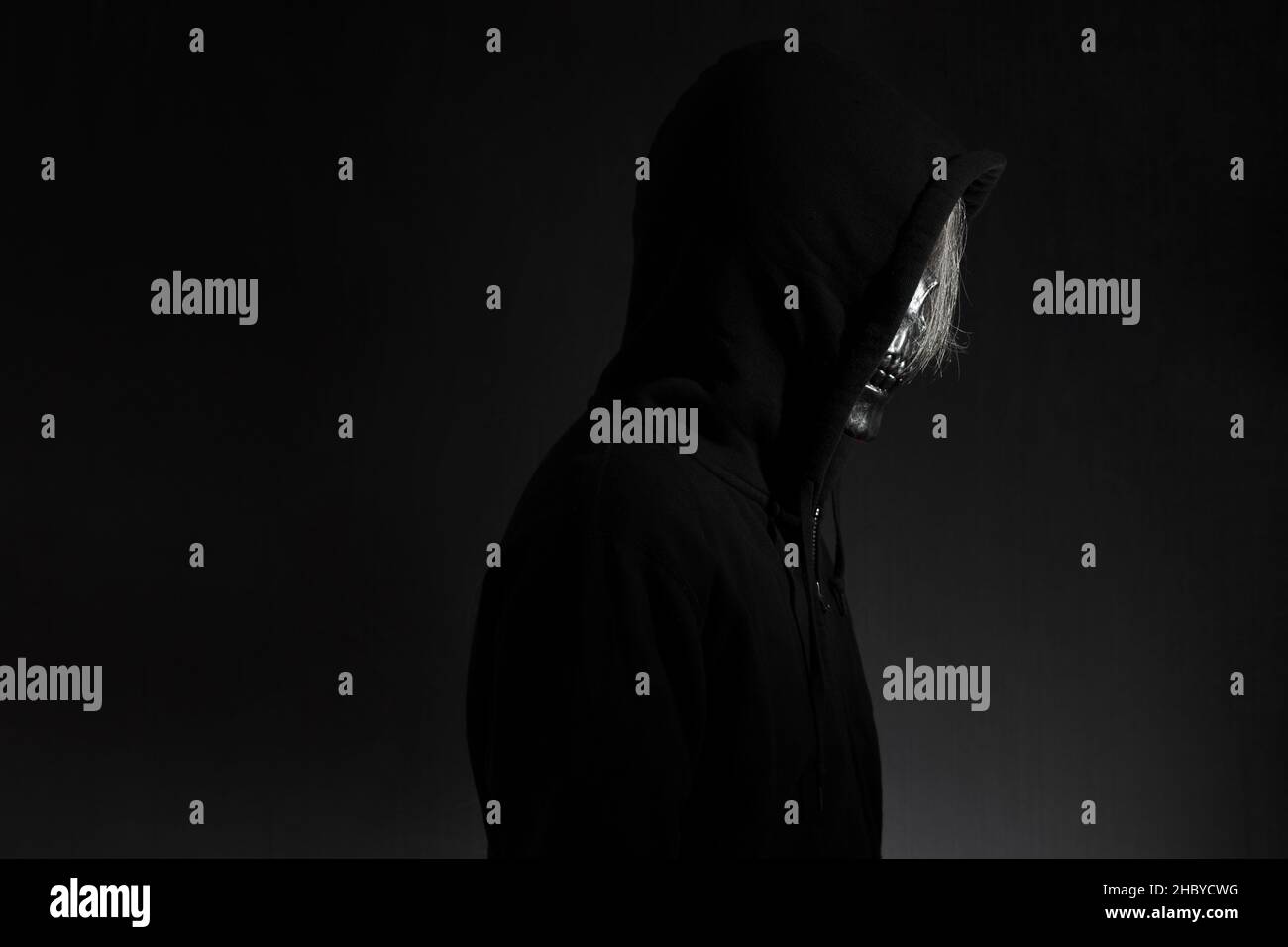The horror man with skull mask standing in the dark Stock Photo - Alamy