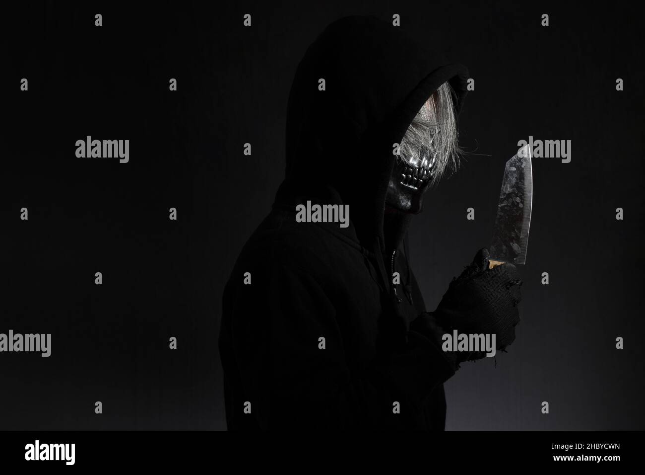 The horror man with skull mask standing in the dark Stock Photo - Alamy