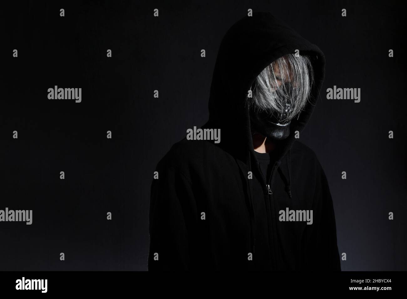 The horror man with skull mask standing in the dark Stock Photo - Alamy