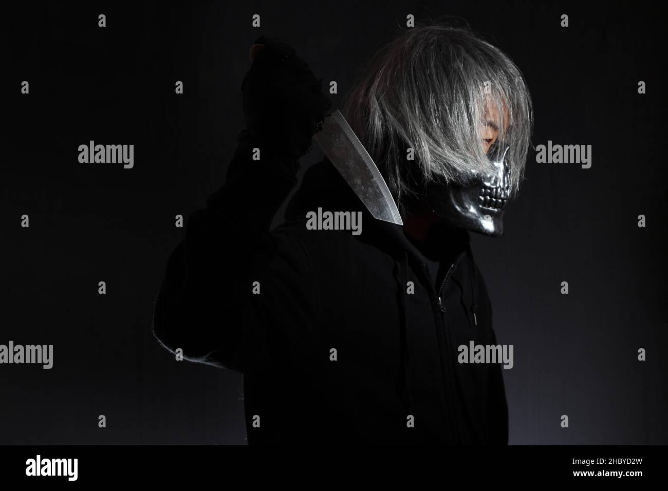 The horror man with skull mask standing in the dark Stock Photo - Alamy