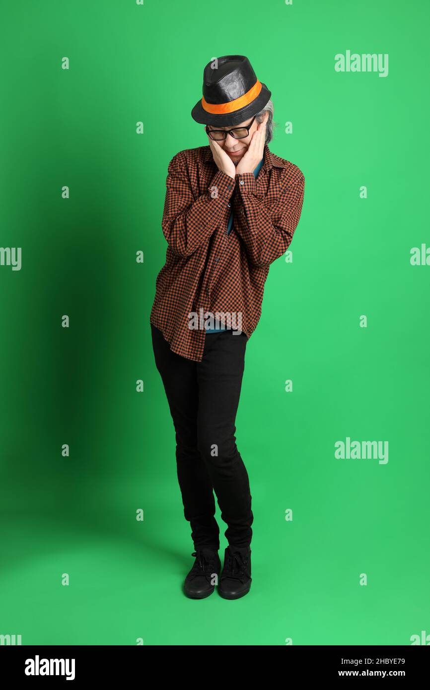 The senior Asian man dressing in Thanksgiving season color theme ...