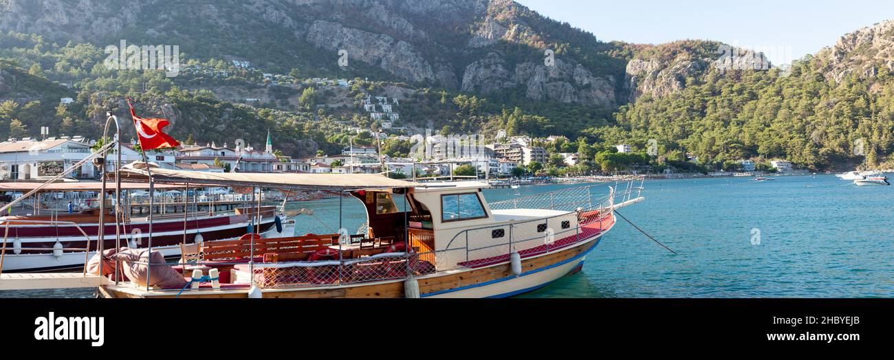 Sea bay surrounded by mountains and rocks in small touristic village ...