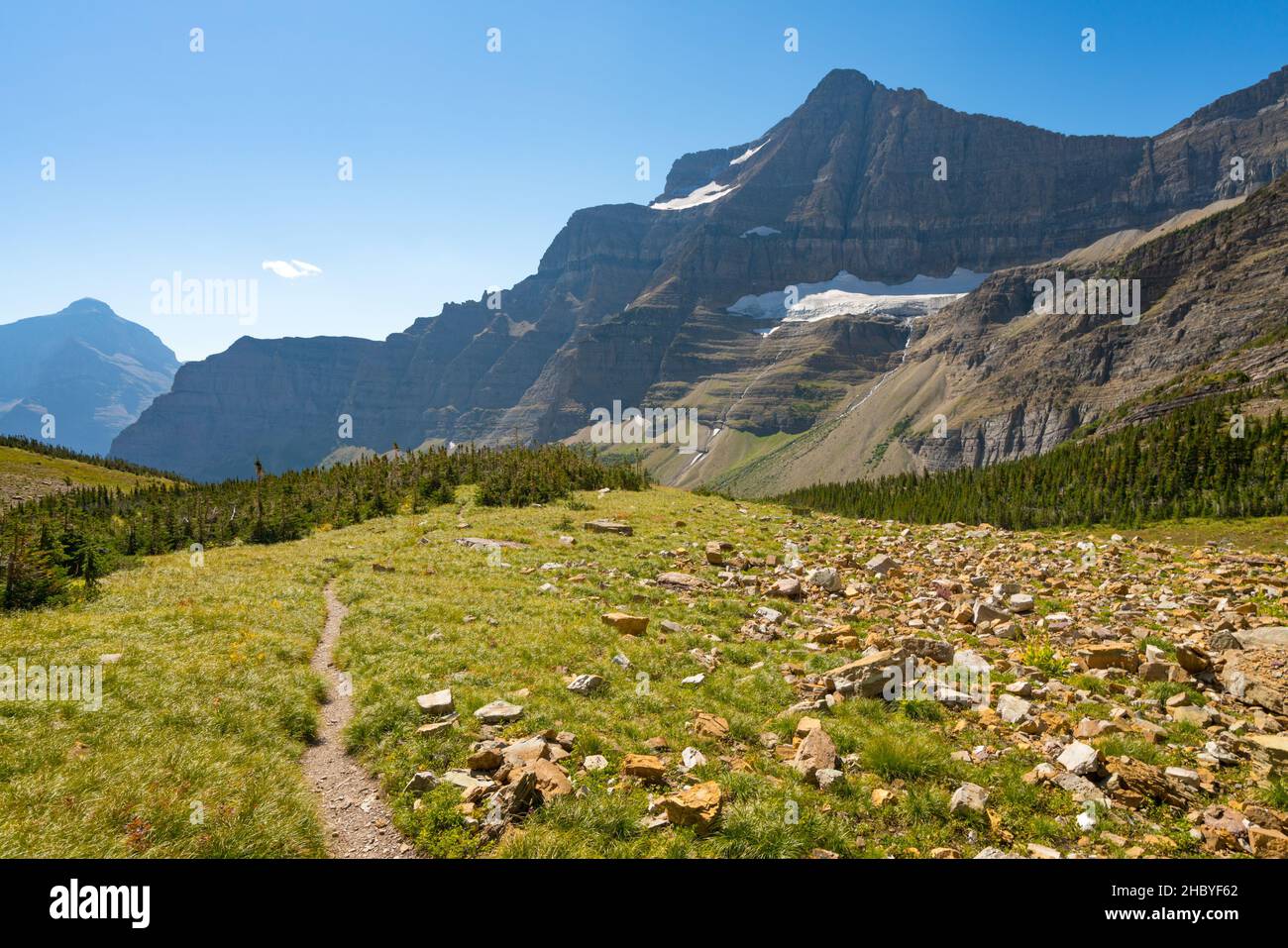 Matahpi Peak and valley below viewed from Siyeh Pass hiking trail ...
