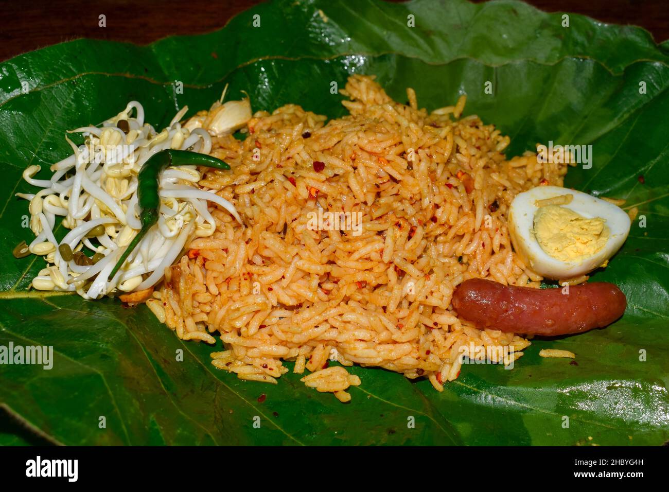Famous Kyangin rice salad wrapped in leaf parcel. Favorite street food ...