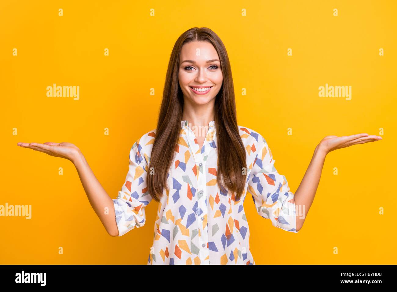 Photo of young attractive woman happy smile hold two hands balance ...