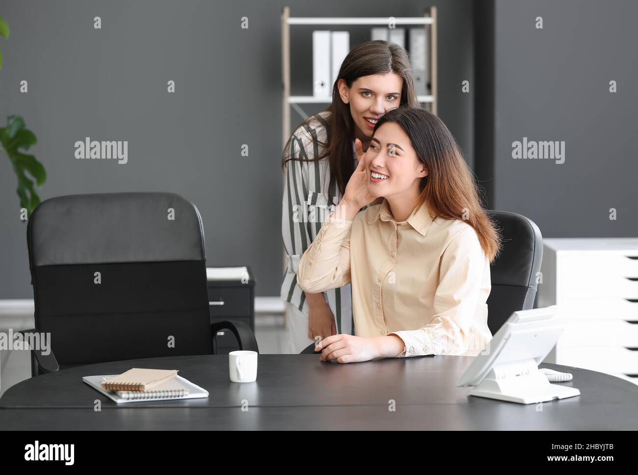 Gossiping in office hi-res stock photography and images - Alamy