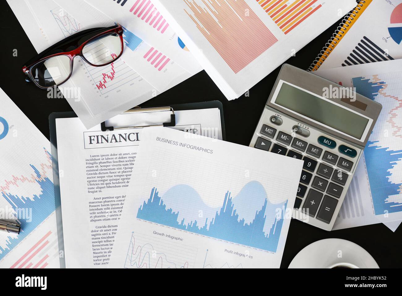 Business documents, calculator and eyeglasses on desk in office Stock ...