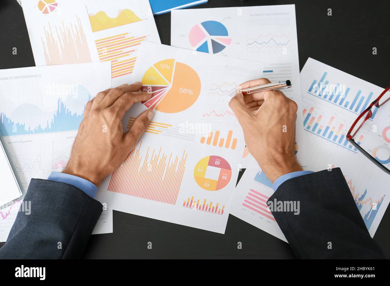 Businessman working diagrams desk hi-res stock photography and images ...