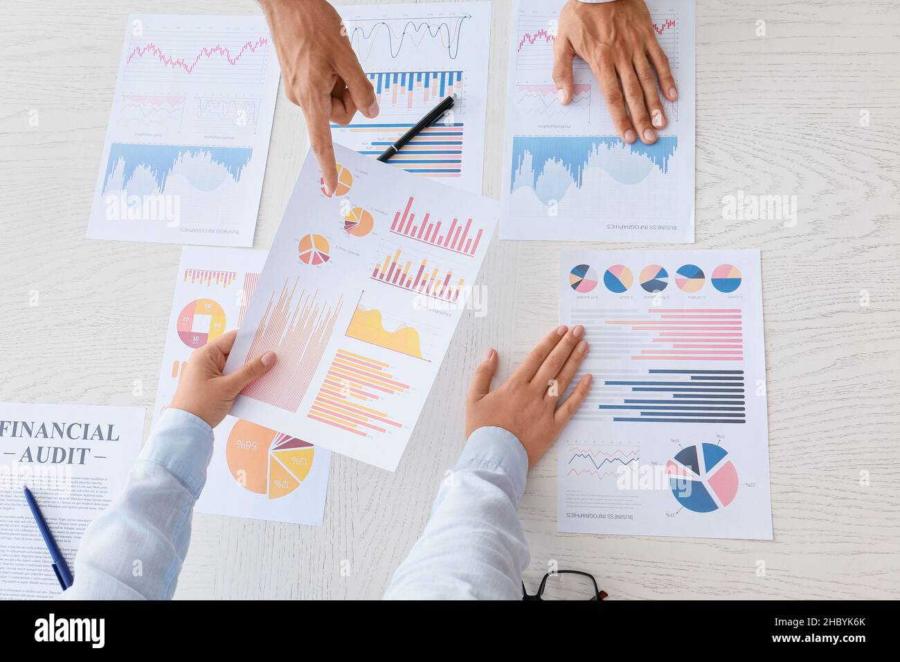 Colleagues working graphs diagrams hi-res stock photography and images ...
