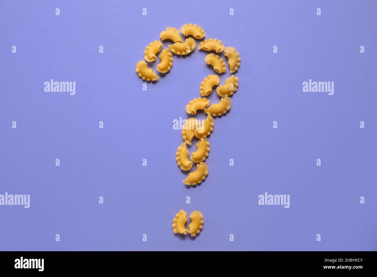 Question mark made of dry pasta on purple background Stock Photo - Alamy