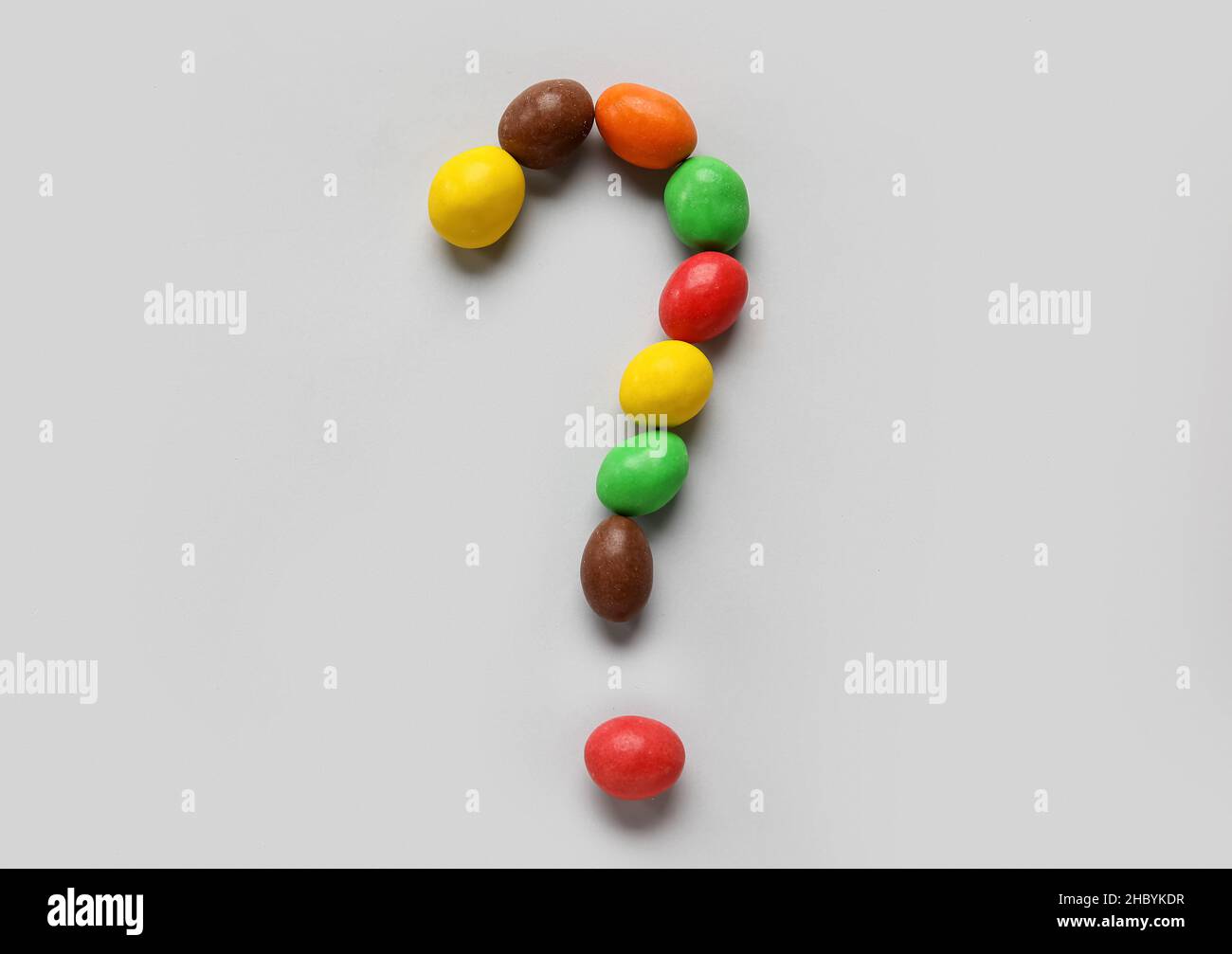 Question mark made of candies on light background Stock Photo - Alamy