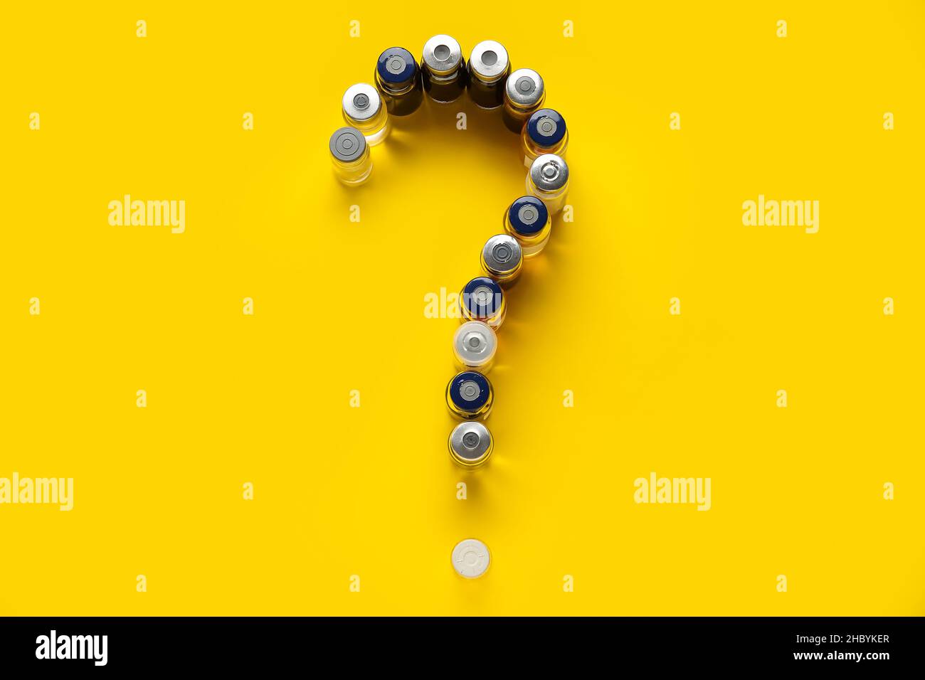 Question mark made of medical bottles on yellow background Stock Photo ...
