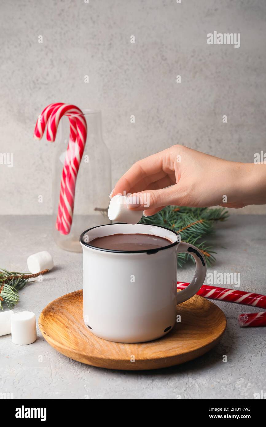 Woman adding marshmallow cup hi-res stock photography and images - Alamy