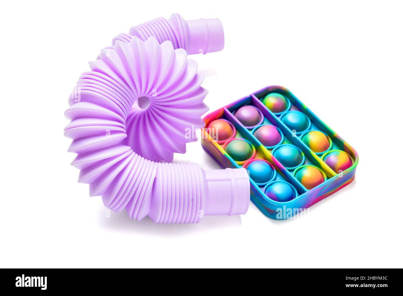 Colorful Pop Tube and Pop it fidget toy on white background Stock Photo ...