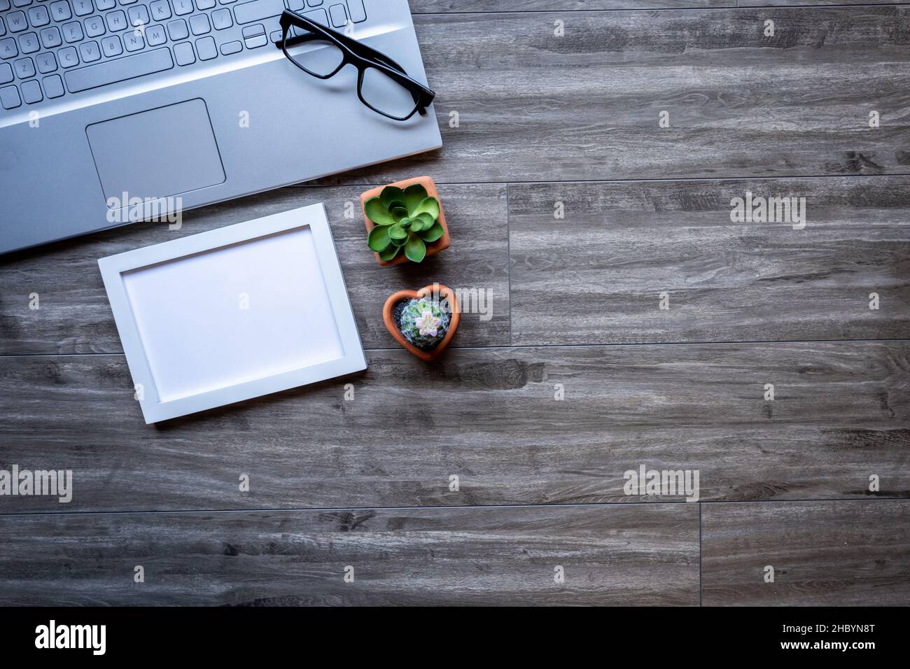 Gray wooden desk table workspace with laptop computer and supplies for ...