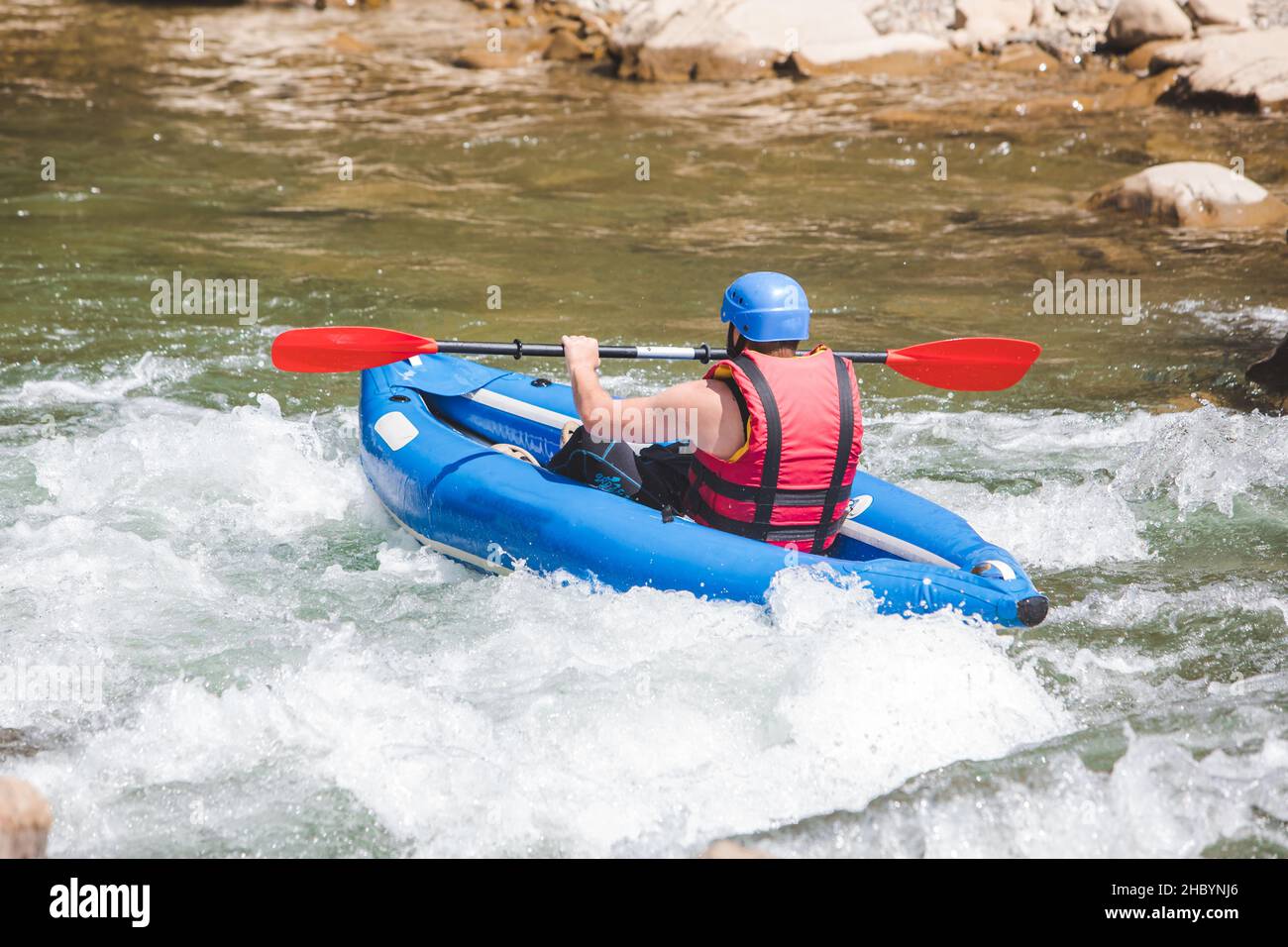 inflatable raft extreme sport at mountain river Stock Photo - Alamy