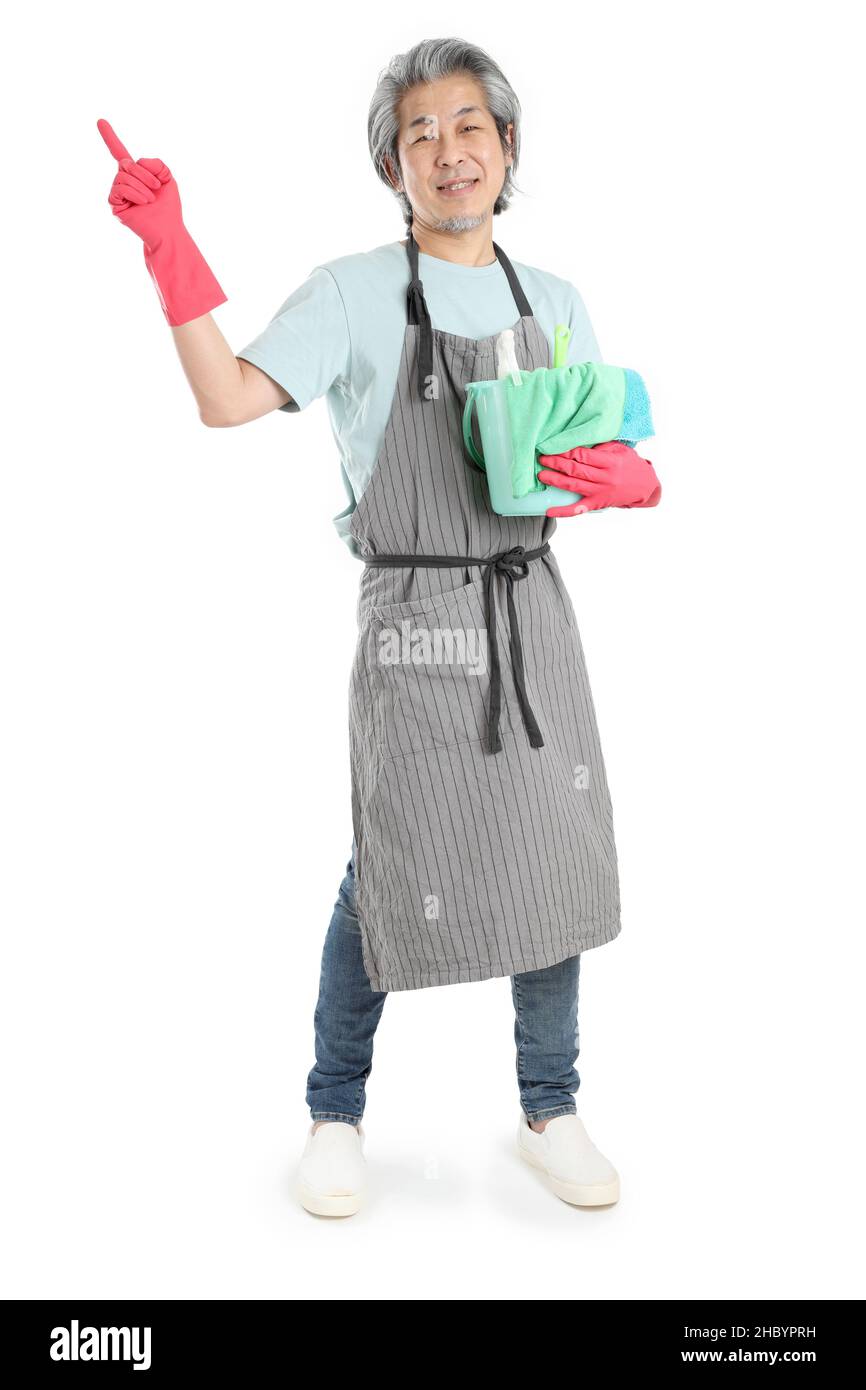 The senior Asian housekeeper standing on the white background Stock ...