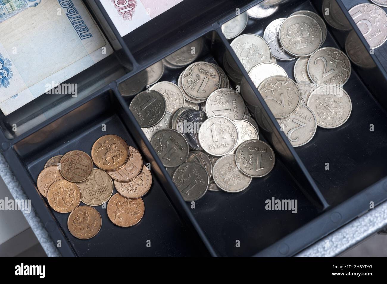 In this photo Russian coins of different denominations in the cash ...