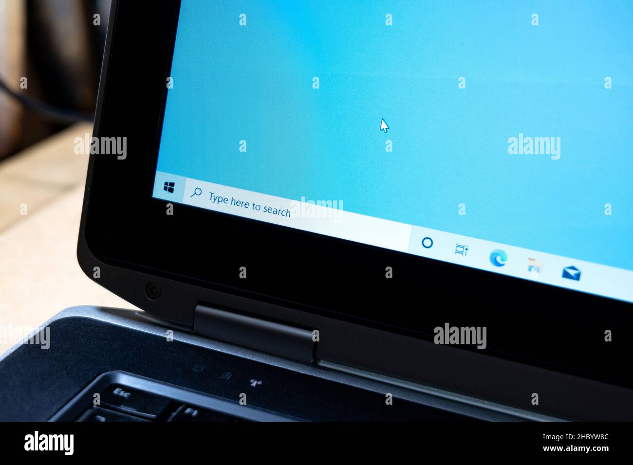 Microsoft Windows 10 OS logo on laptop task bar, search bar, start menu ...