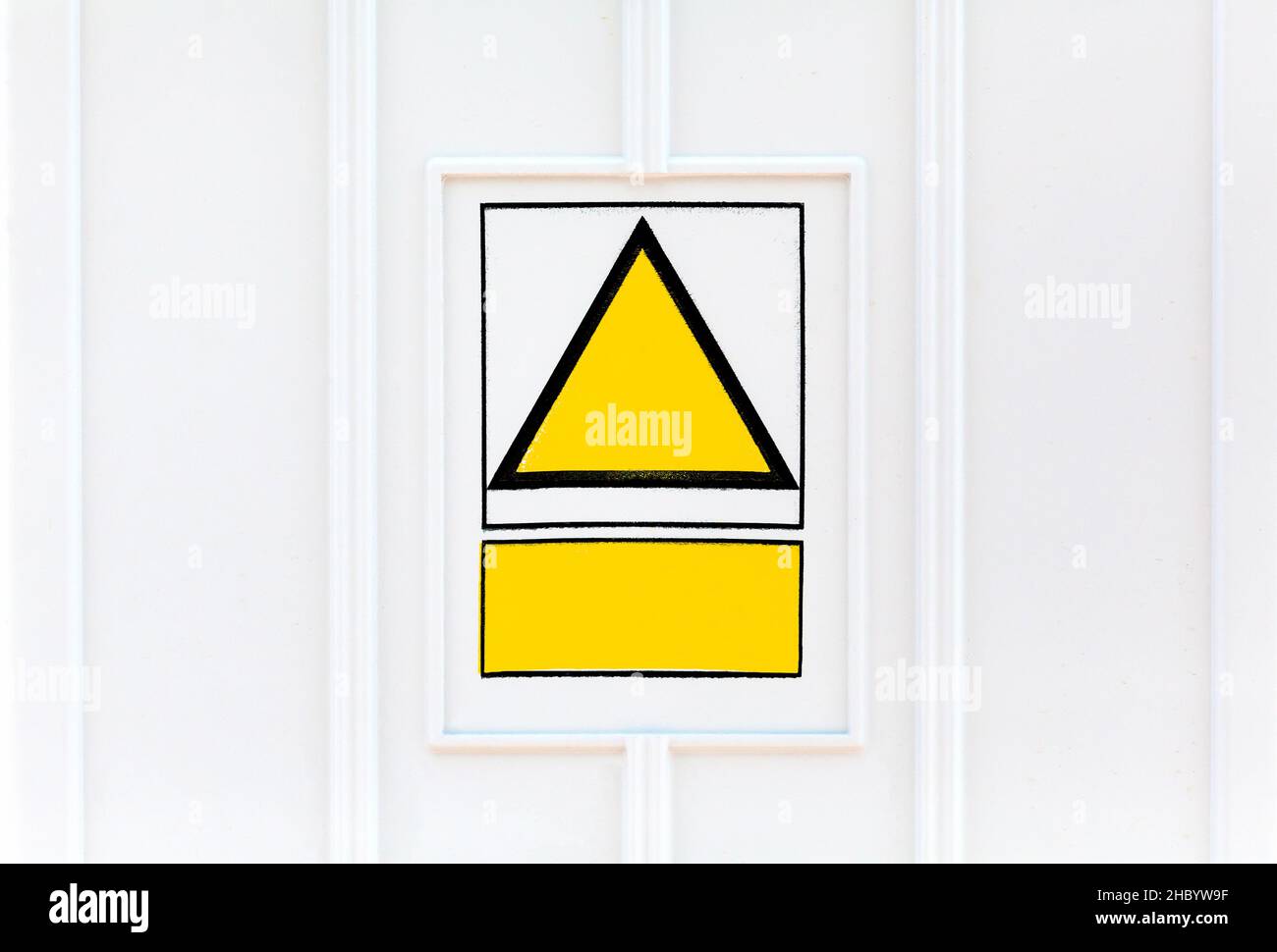 Yellow triangle blank empty industrial warning sign, metal plate on the ...