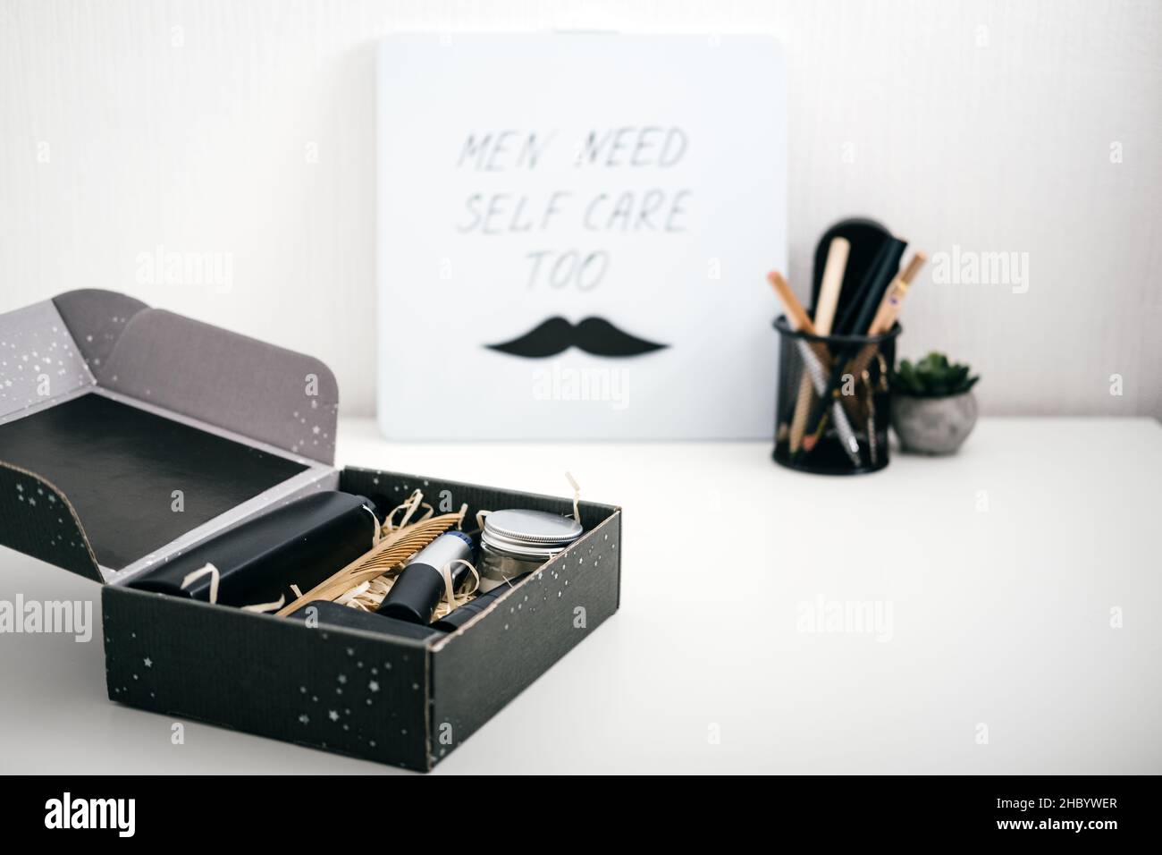 Men self care kit black box with male beauty care products and devices ...