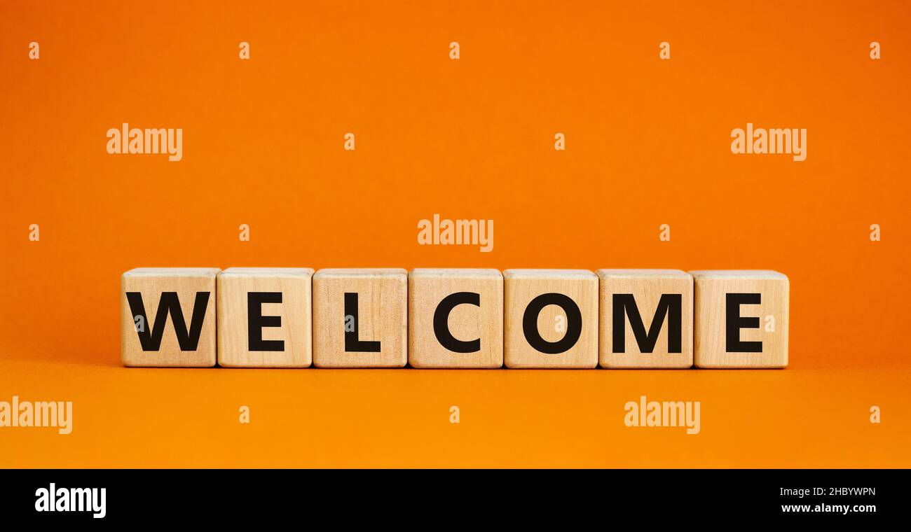 Welcome and support symbol. The concept word Welcome on wooden cubes ...