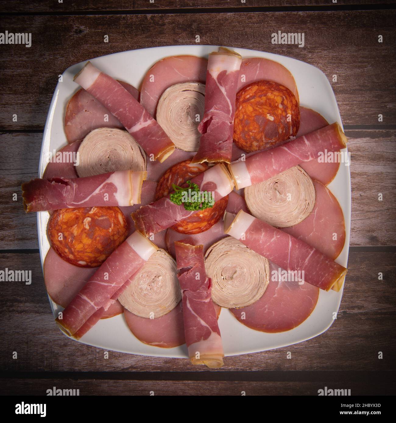 Food tray with delicious salami, pieces of sliced ham, sausage, Deli ...