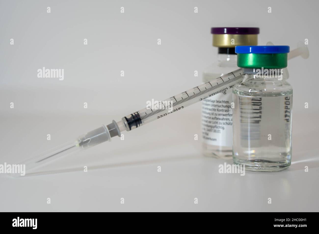 bottles with medication and injection solution, syringe, equipment for ...