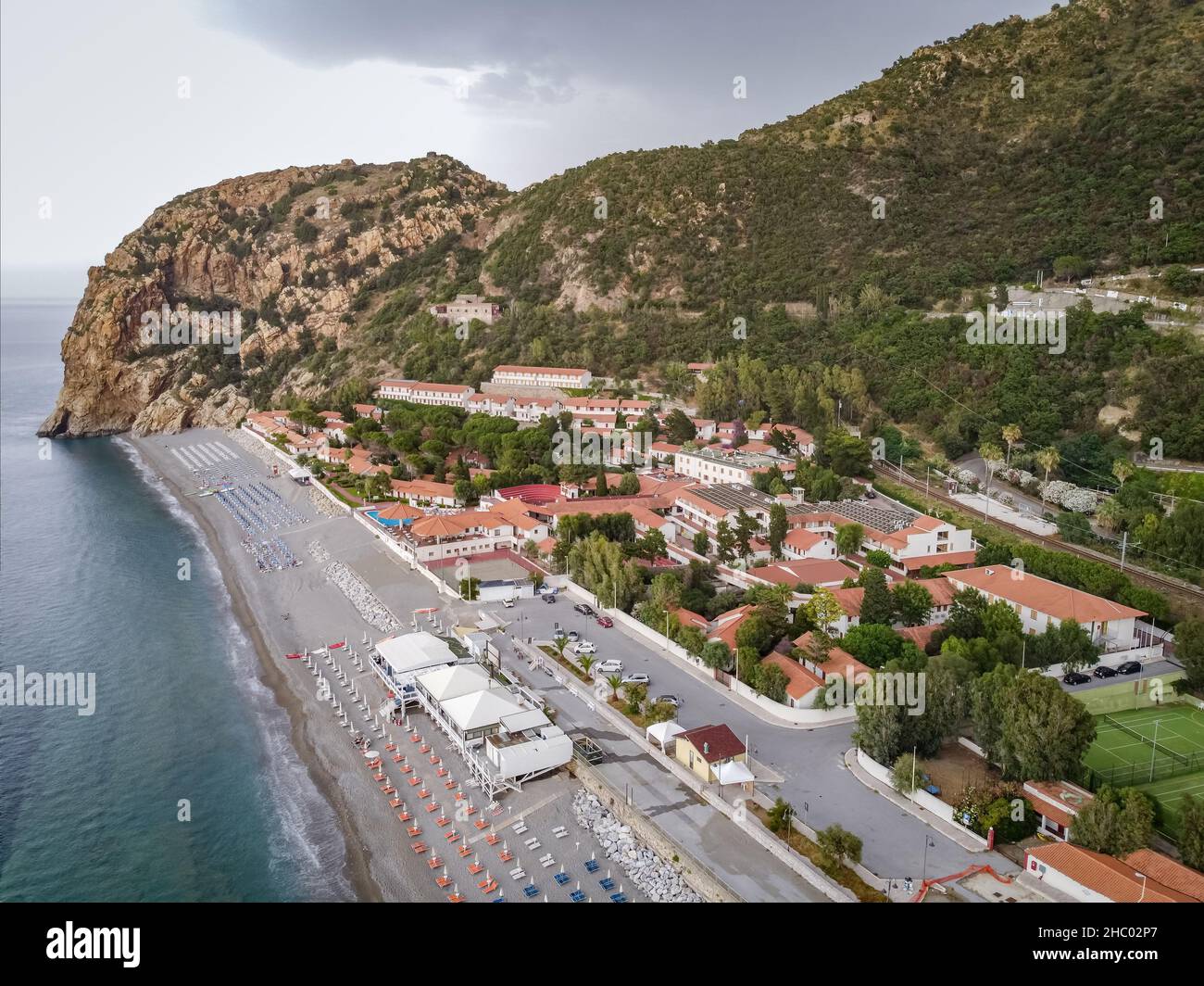 Aerial drone. Capo Calava bay and beach, with several holiday parks and ...