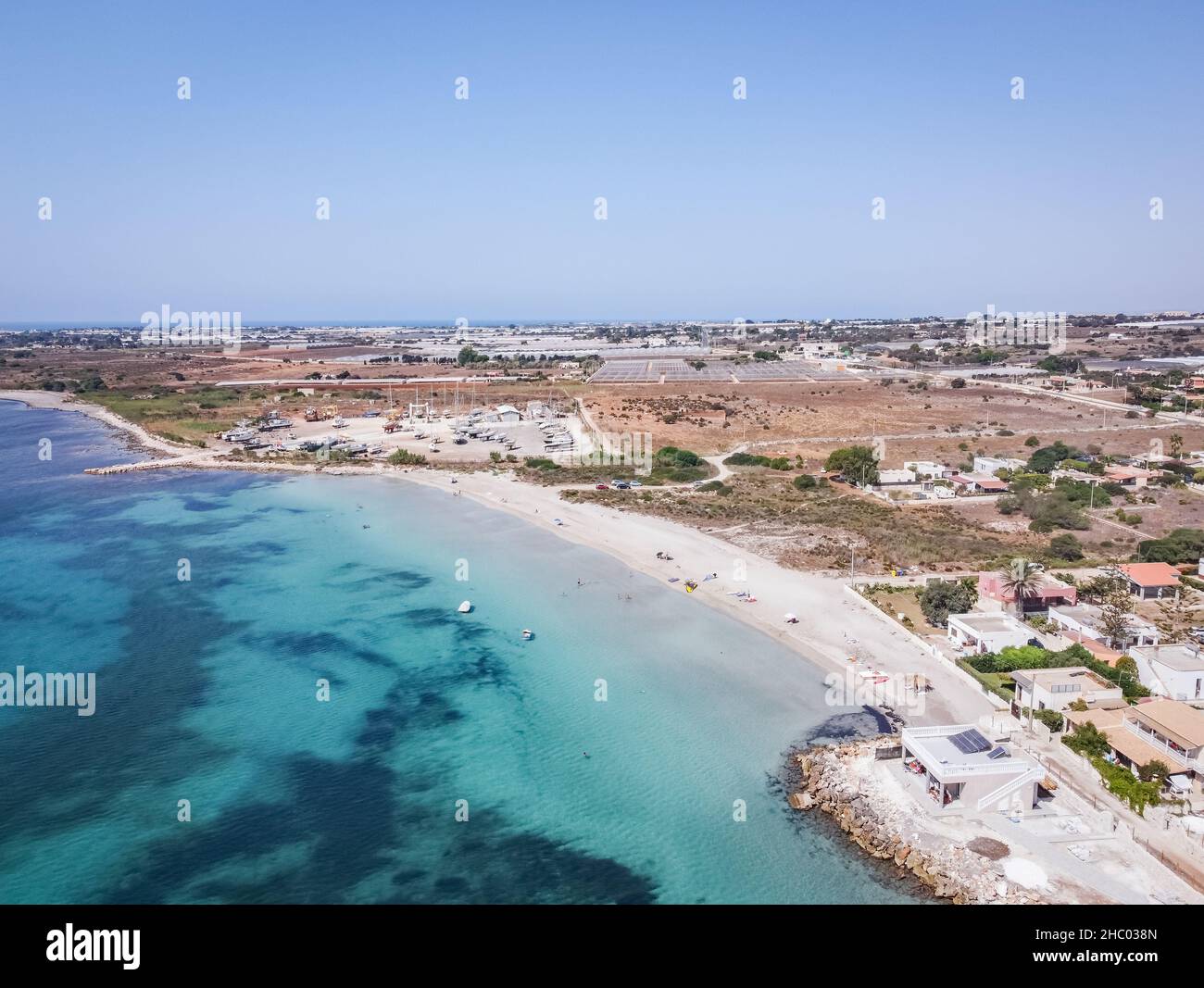 Aerial drone view of the beach and harbour of Portopalo di Capo Passero ...