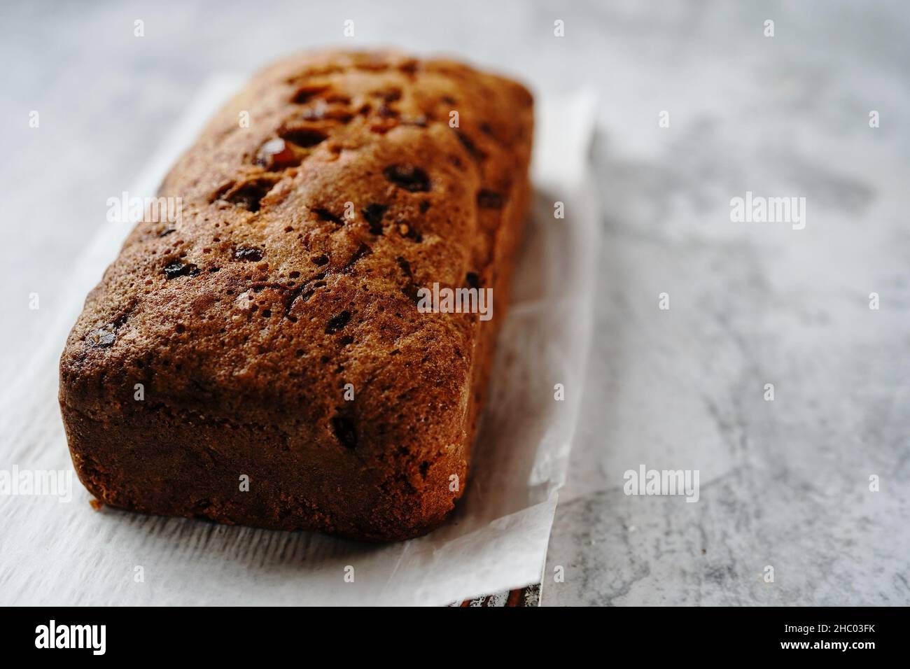 Homemade Christmas fruit cake loaf with copy space, selective focus ...