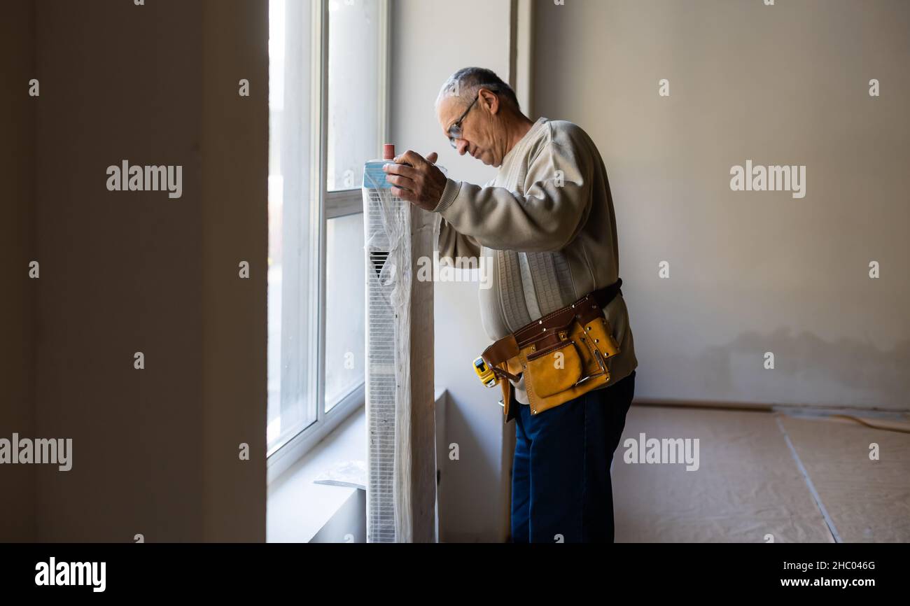 Windows installation worker. window customizer Stock Photo - Alamy