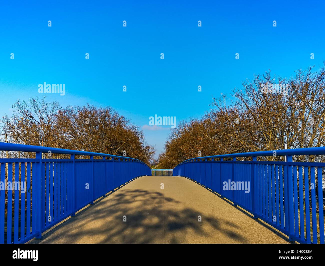 Small bridge over roads with blue metal railings on both sides Stock ...