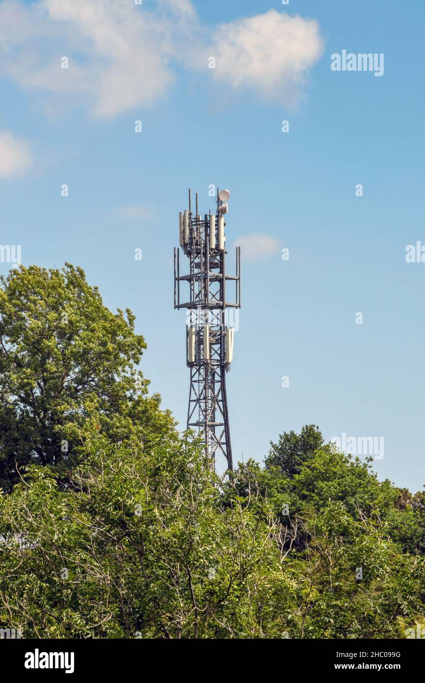 Pontypridd, Wales - July 2018: Mobile phone mast in a farm field behind ...