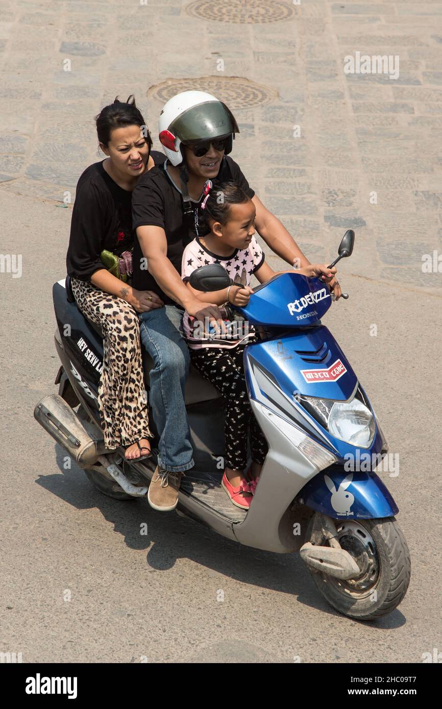 Three people riding a motorcycle hi-res stock photography and images ...