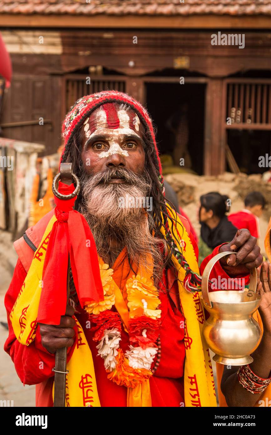 A sadhu, Hindu ascetic or holy man begging for alms in Hanuman Dhoka ...