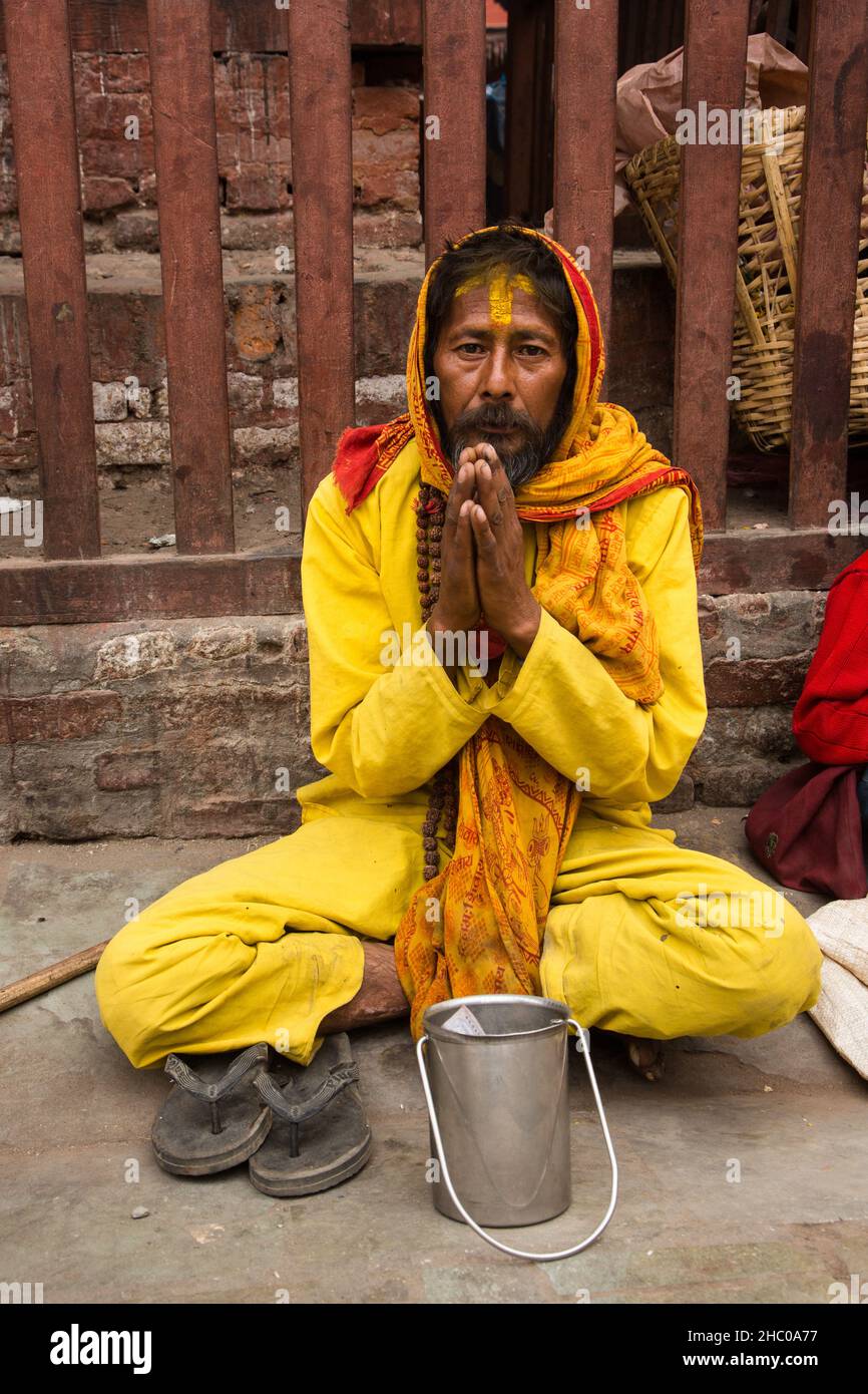 A sadhu, Hindu ascetic or holy man begging for alms in Hanuman Dhoka ...