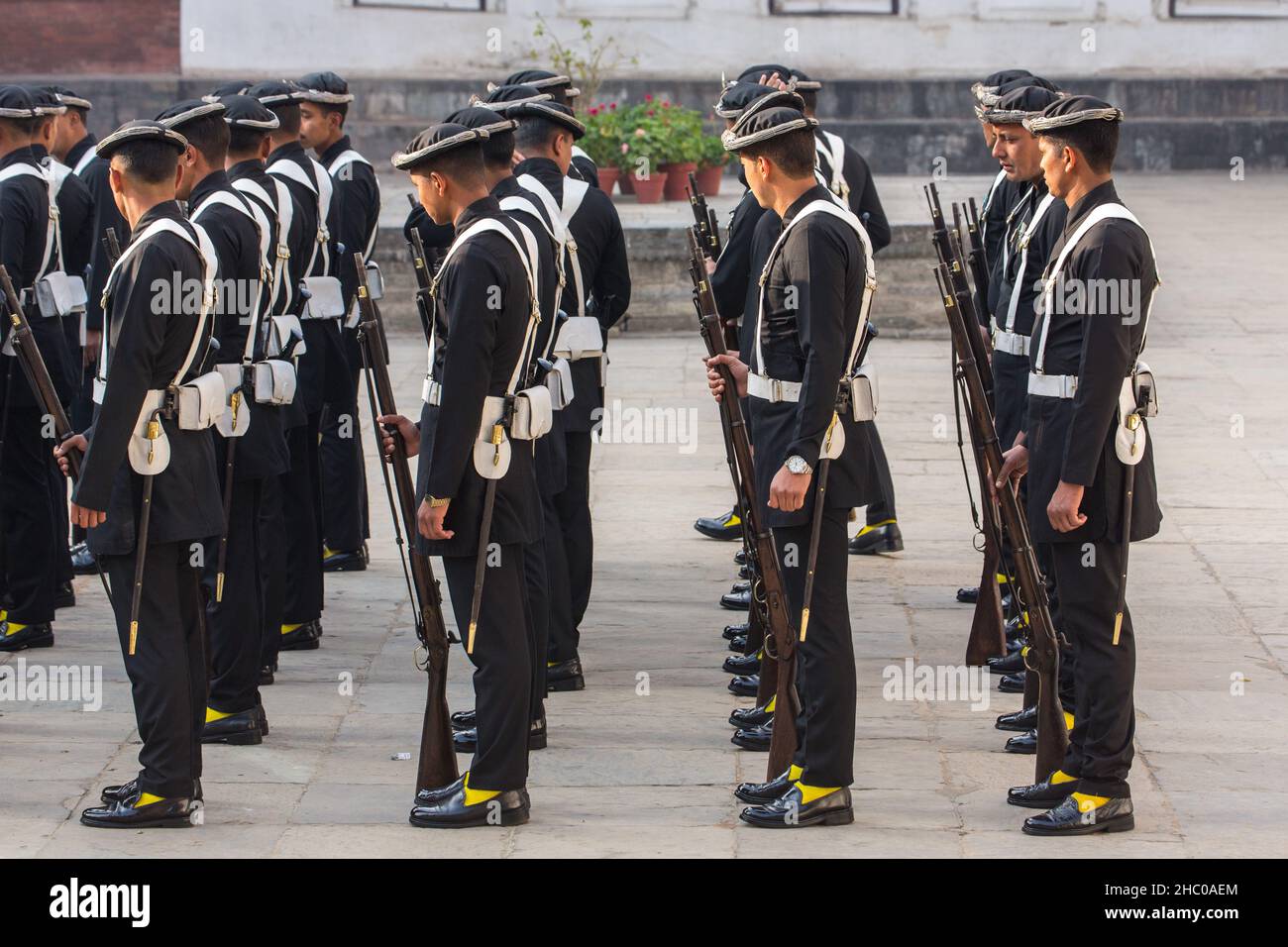 Gurkha soldiers in traditional uniforms form ranks for ceremonial duty ...