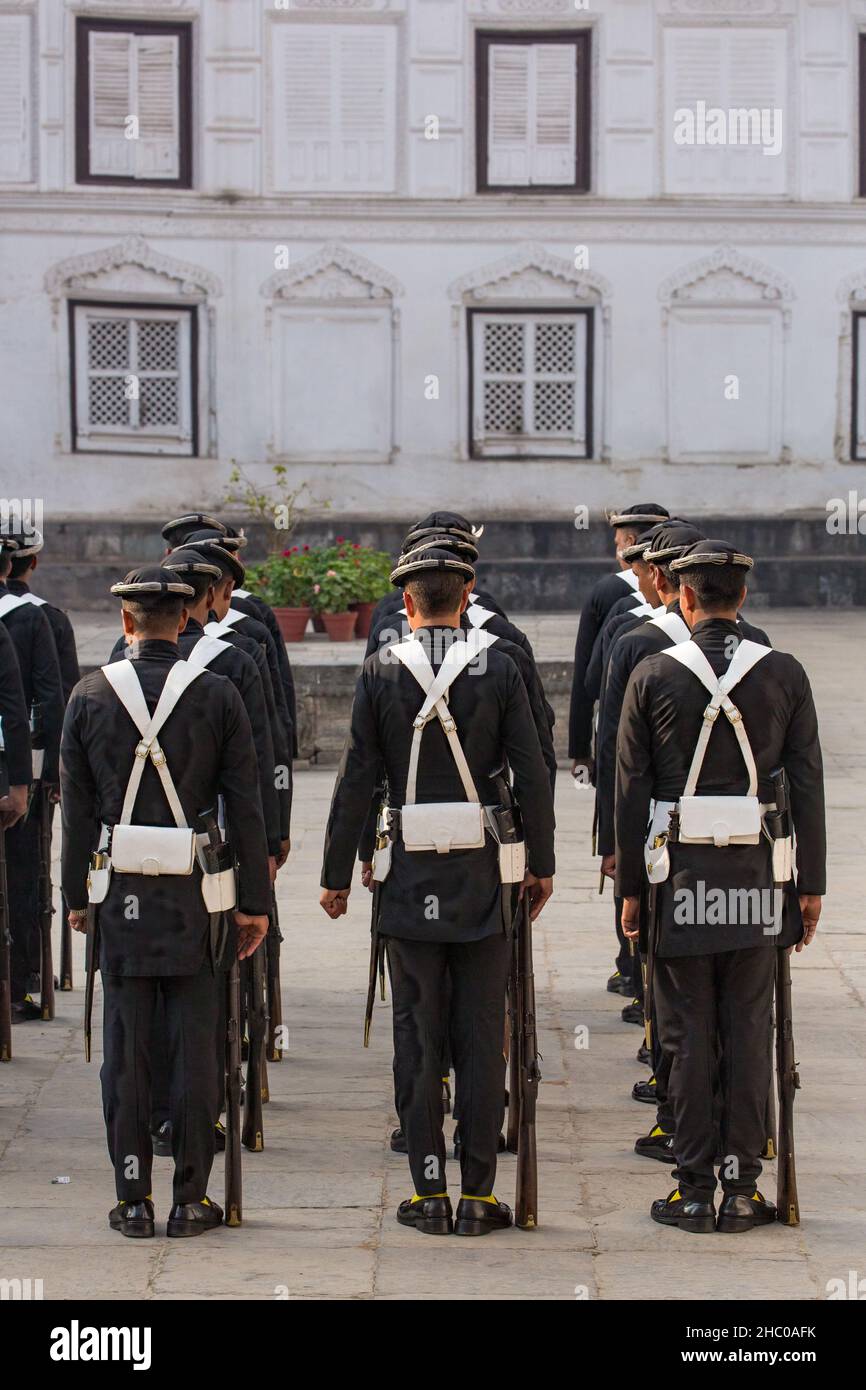 Gurkha soldiers in traditional uniforms form ranks for ceremonial duty ...