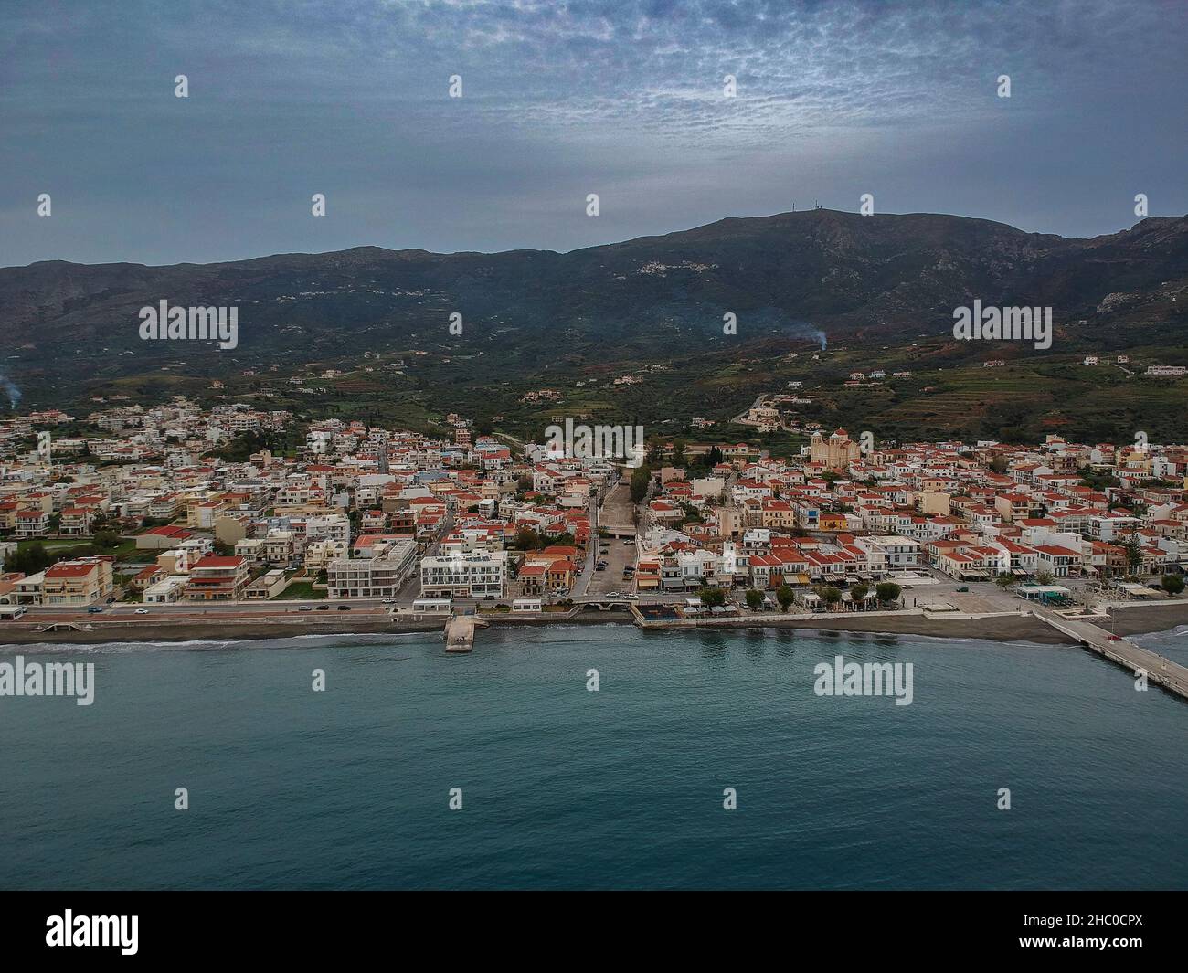 Aerial cityscape view of Neapolis town at sunset. Also named Vatika in ...