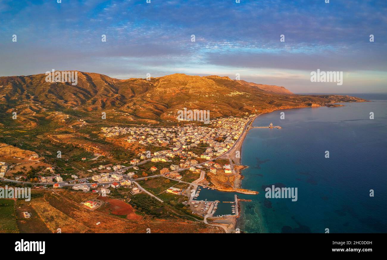 Aerial cityscape view of Neapolis town at sunset. Also named Vatika in ...