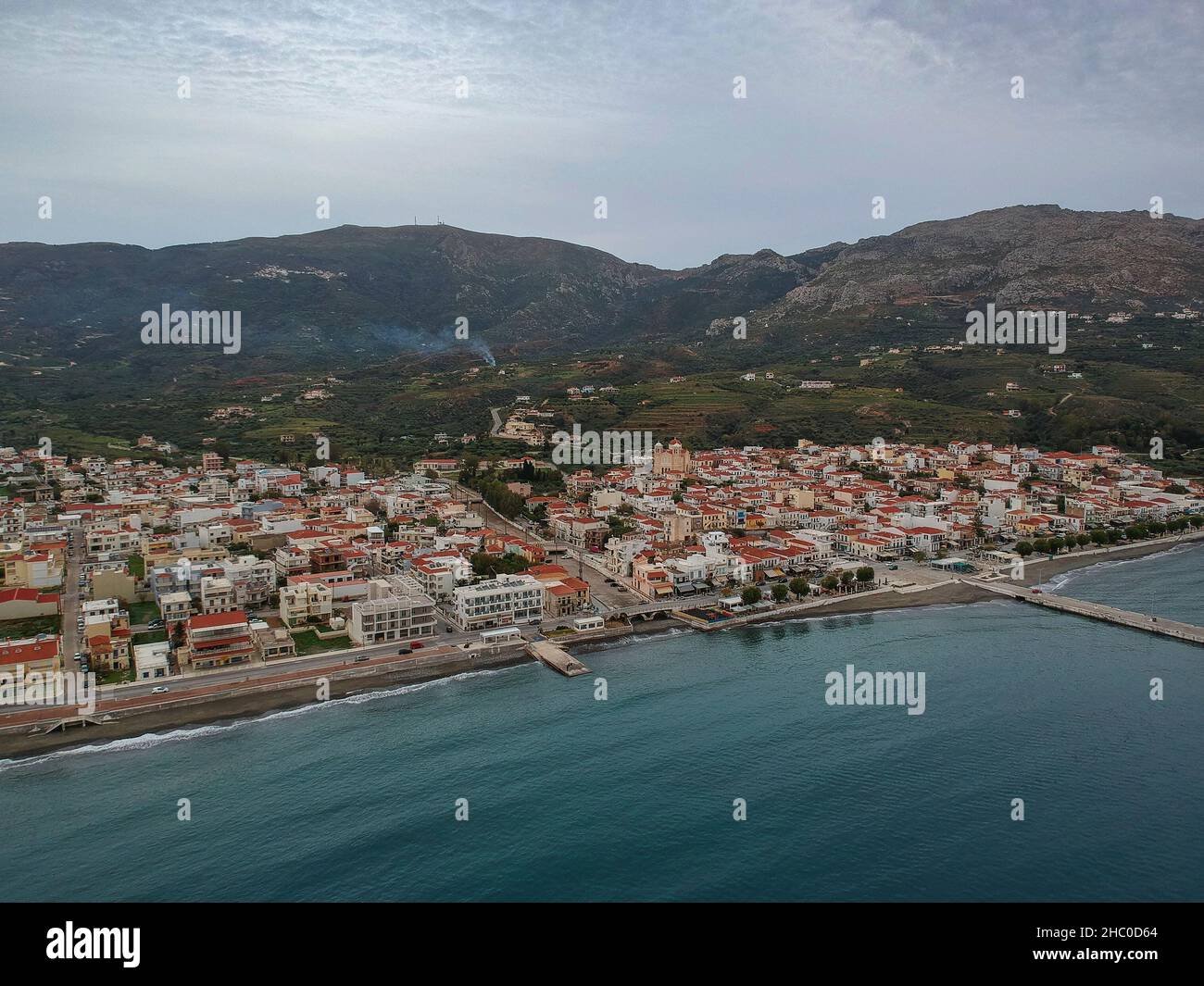 Aerial cityscape view of Neapolis town at sunset. Also named Vatika in ...