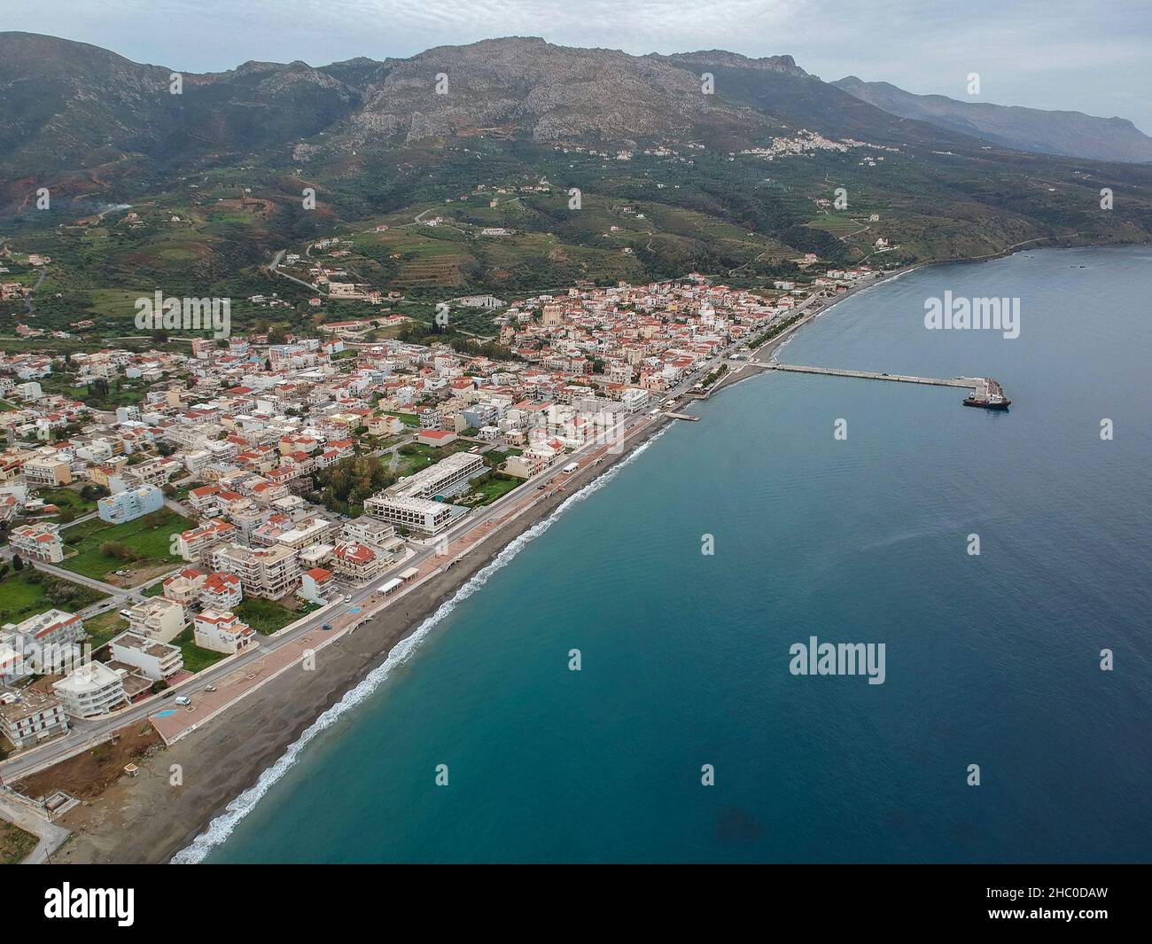Aerial cityscape view of Neapolis town at sunset. Also named Vatika in ...