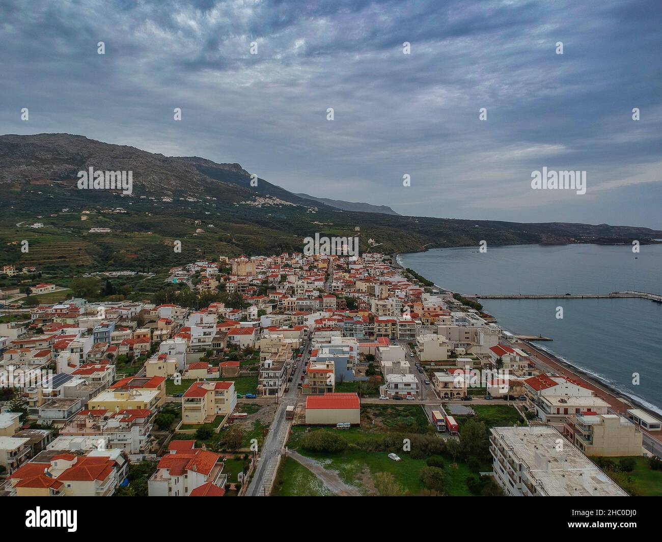 Aerial cityscape view of Neapolis town at sunset. Also named Vatika in ...