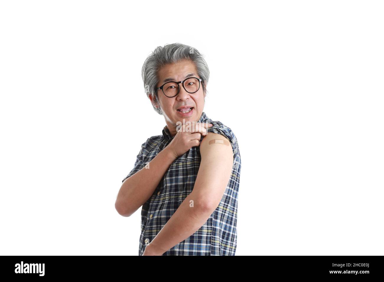 The senior Asian man showing plaster on his shoulder Stock Photo - Alamy