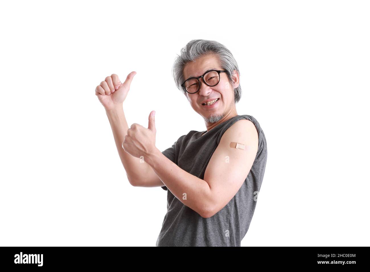 The senior Asian man showing plaster on his shoulder Stock Photo - Alamy